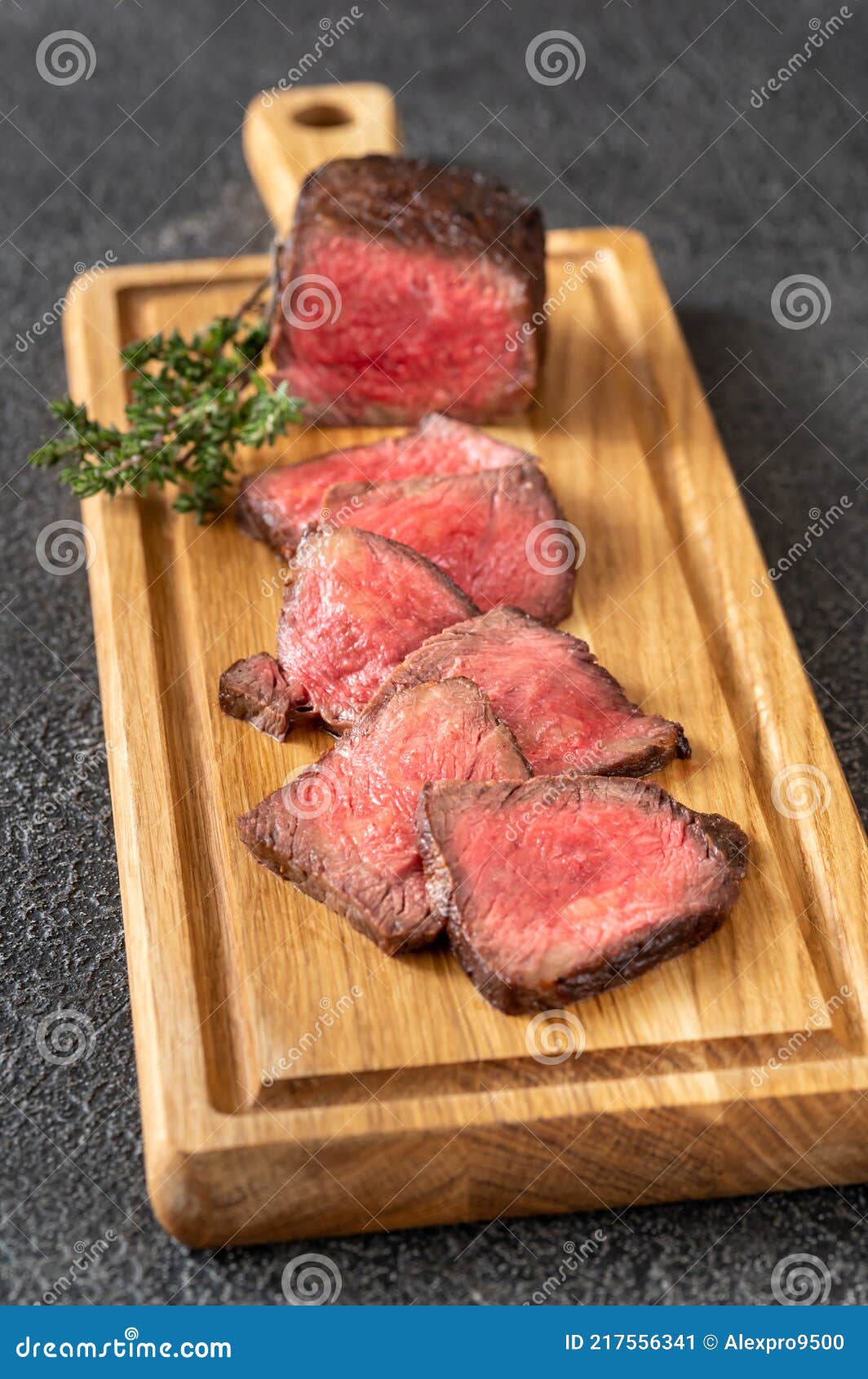 Slices of beef steak stock image. Image of rustic, beefsteak - 217556341