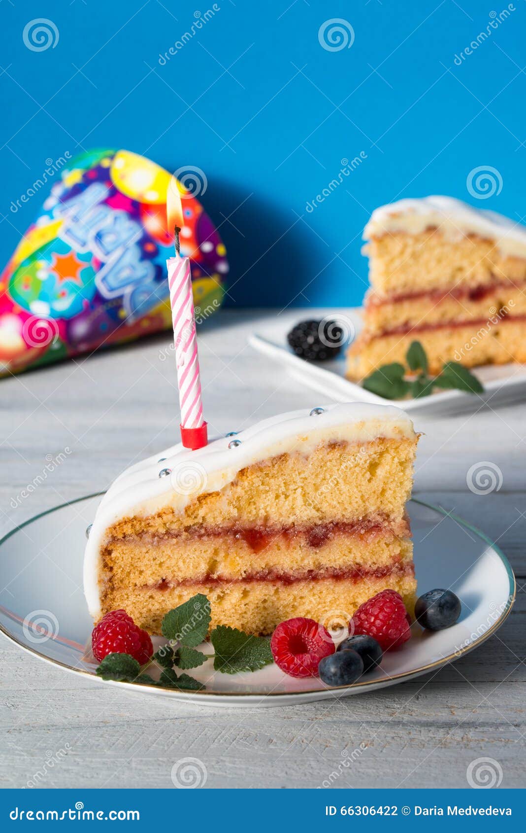 Slices of Birthday Cake with Candle and Party Cap Stock Photo - Image ...