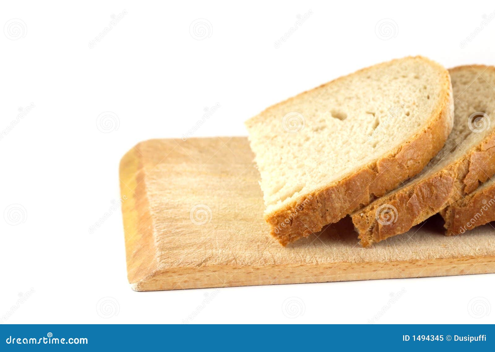 Slices of bread on board stock image. Image of detail - 1494345