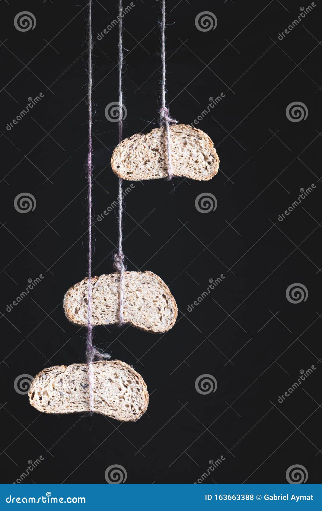 Slices of Bread Hung with Ropes Stock Photo - Image of baking, baguette ...