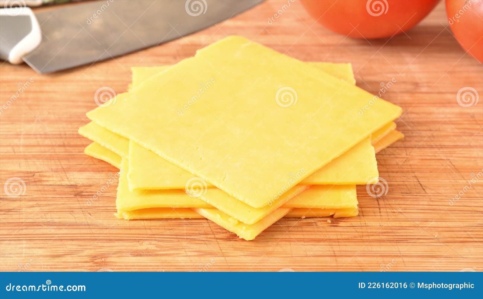Slices of Cheddar Cheese Vanishing from a Stack on a Cutting Board ...