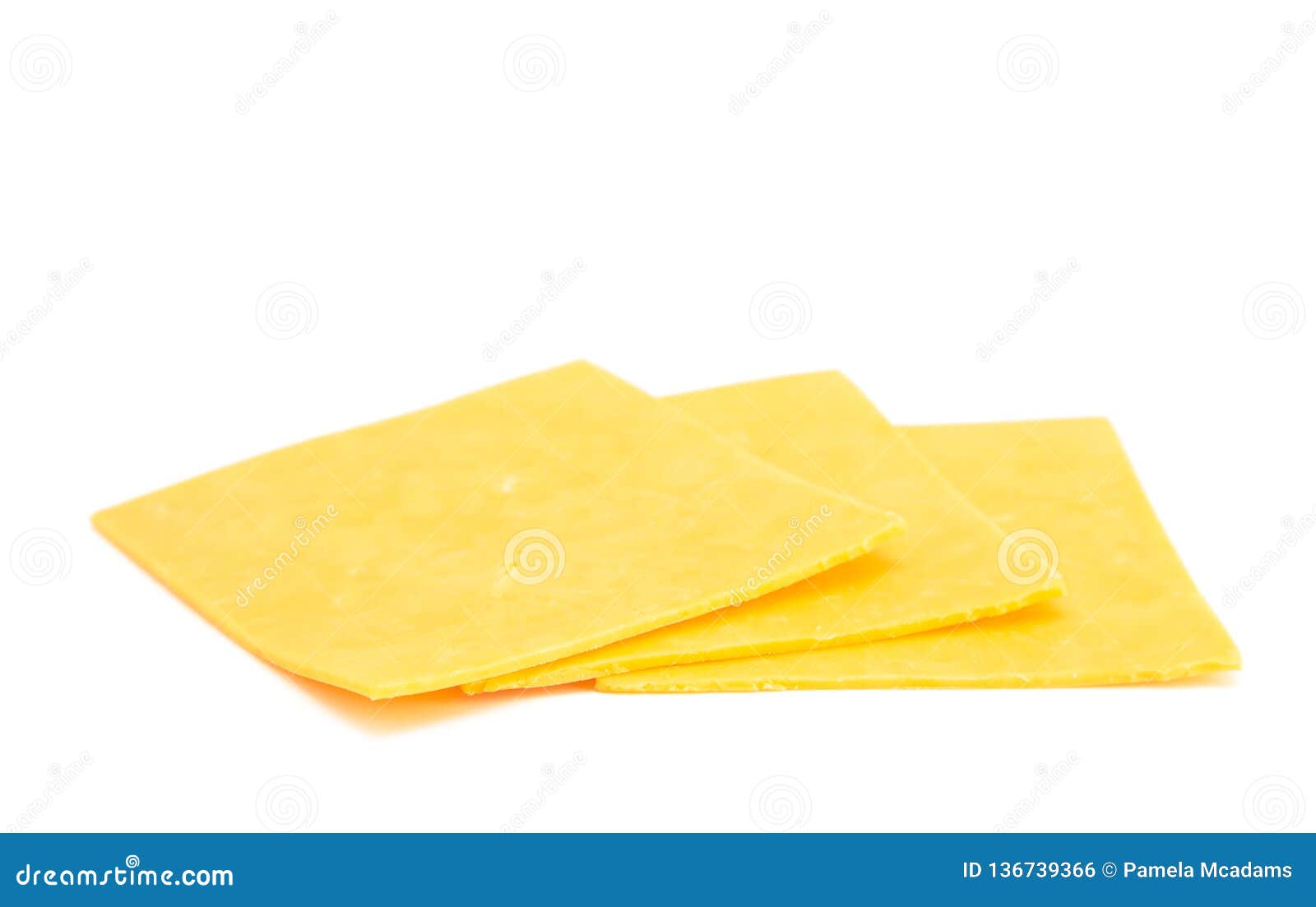 Slices of Cheddar Cheese on a White Background Stock Photo - Image of ...