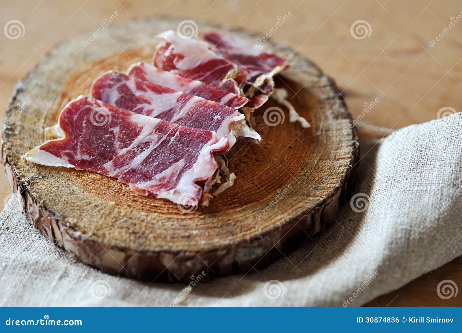 Slices of Cured Jamon on a Wooden Cutting Board Stock Photo - Image of ...
