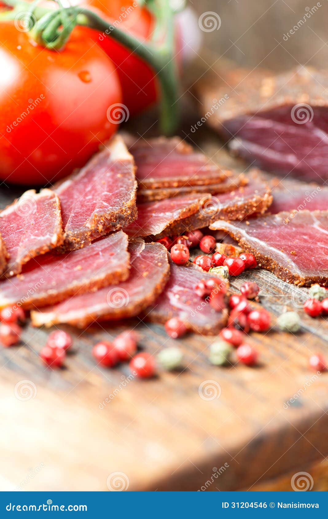 Slices of Cured Meet on Wooden Table Angled View Stock Photo - Image of ...