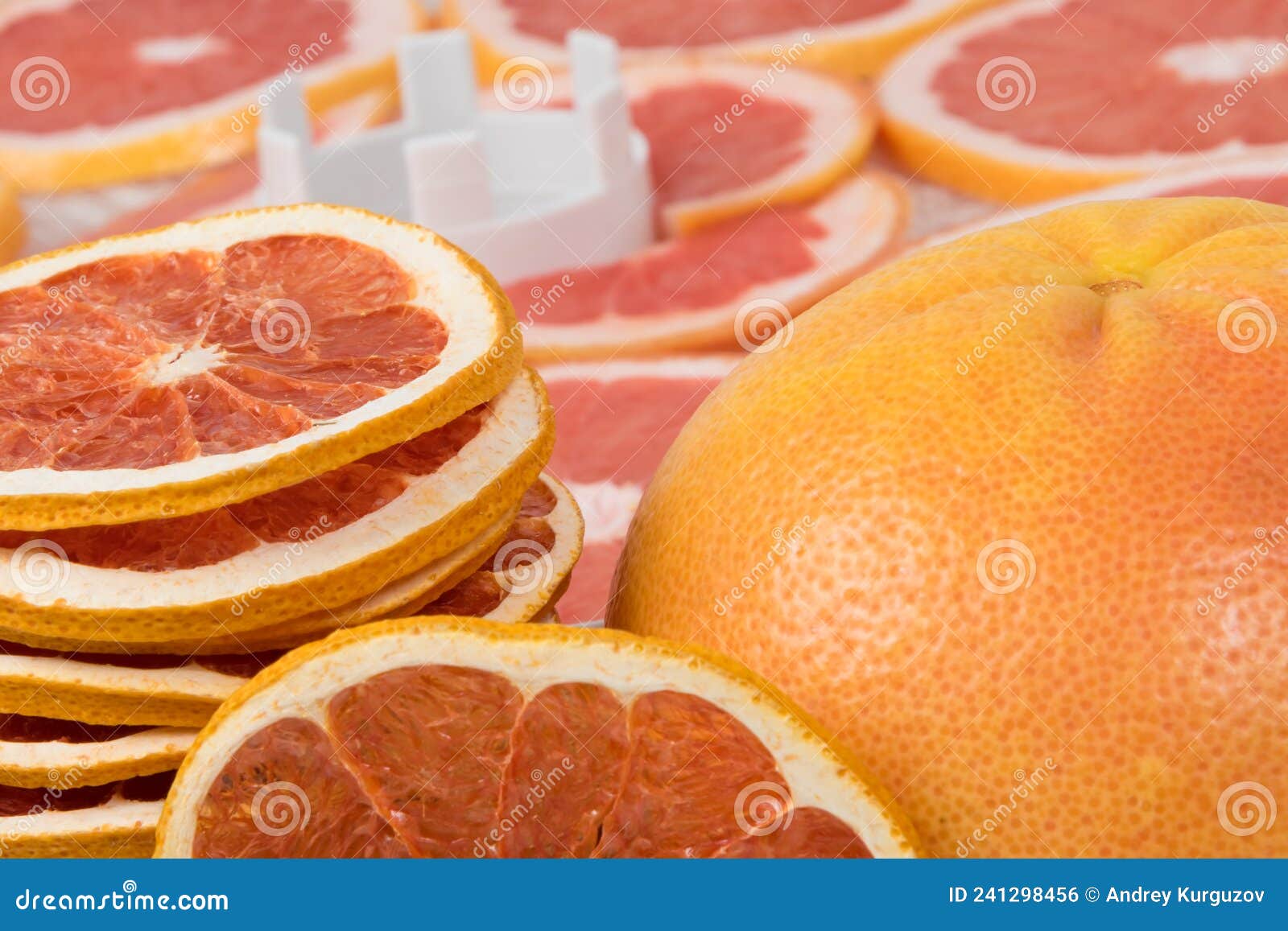 Slices of Fresh and Dried Grapefruit on Drying Trays, Close-up Stock ...
