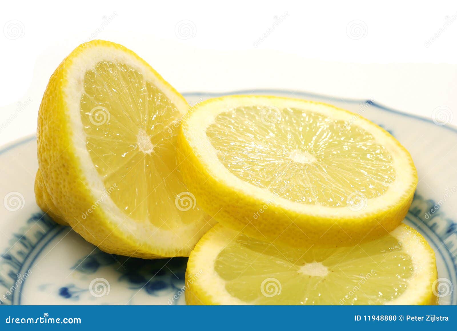 Slices of Fresh Lemon on a Plate Stock Photo - Image of ripe, single ...