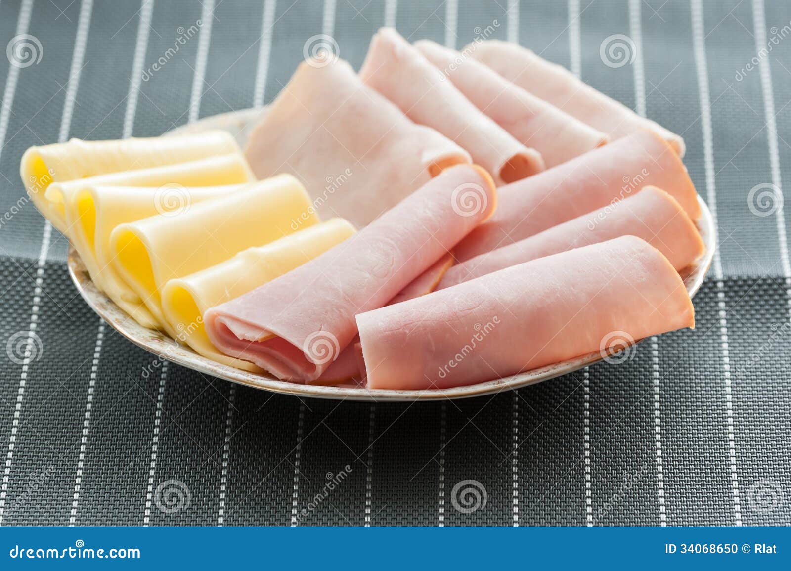 Slices of Ham and Cheese on Plate Stock Photo - Image of catering ...