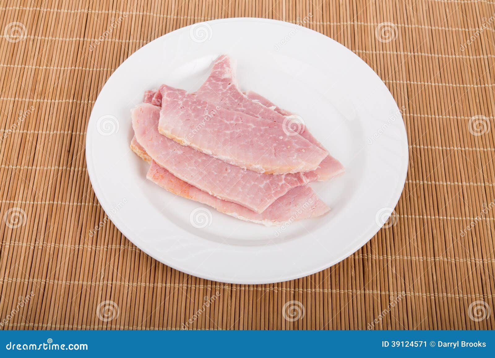 Slices of Ham on White Plate and Bamboo Mat Stock Image - Image of ...