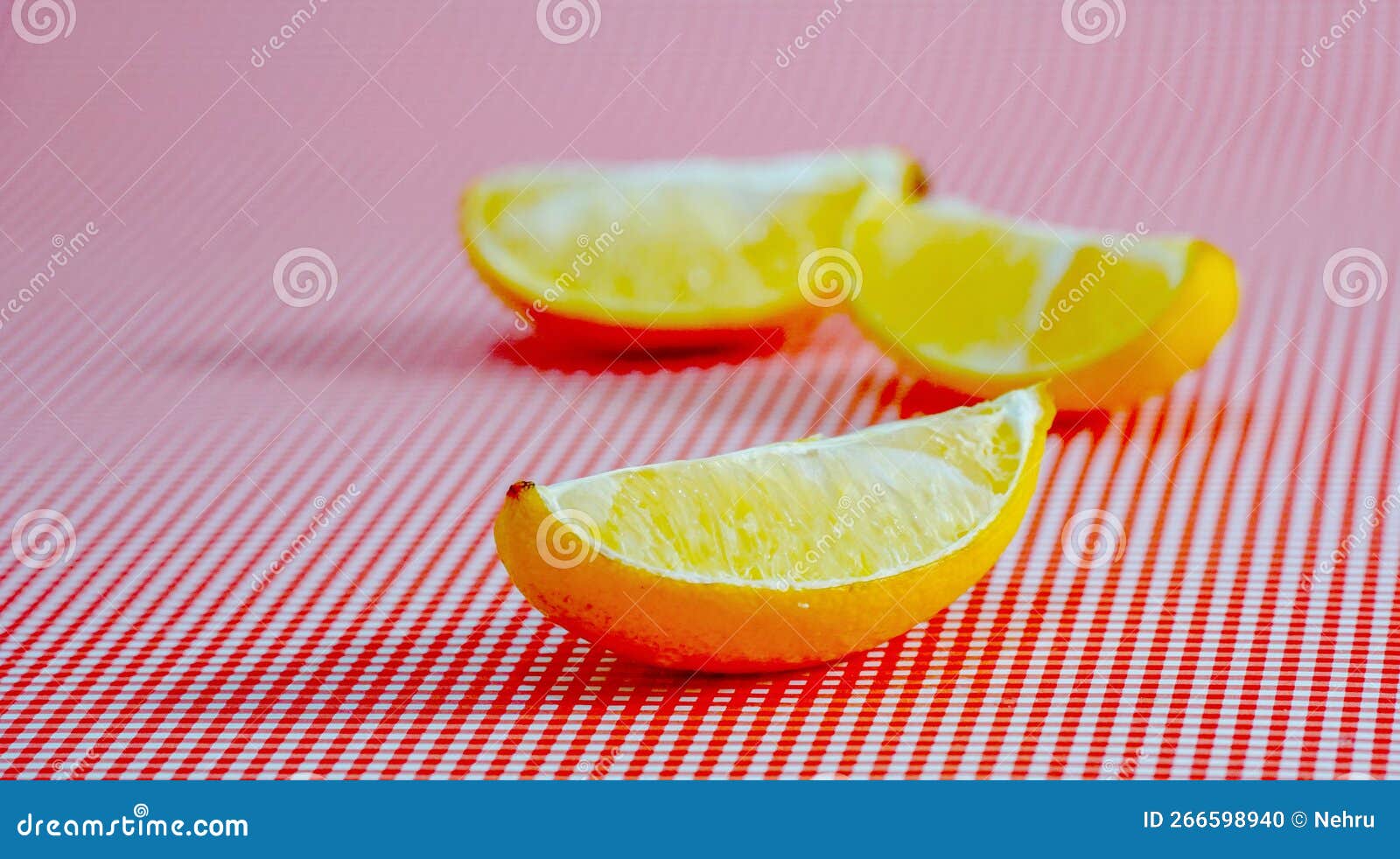 Slices of Lemon Citrus Fruit on Pink Stripped Background. Lemon Slice ...