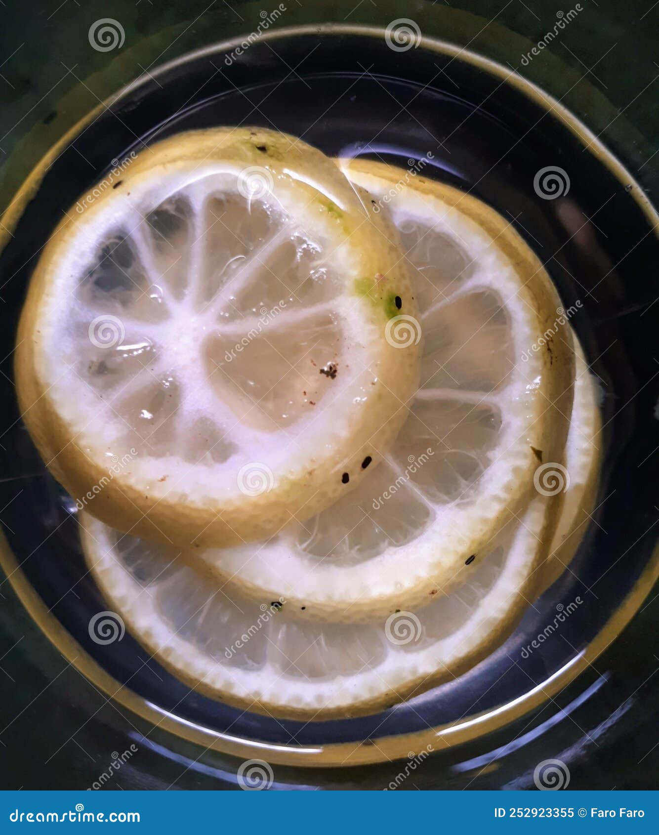 Slices of Lemon Floating in Warm Water Stock Image - Image of glass ...