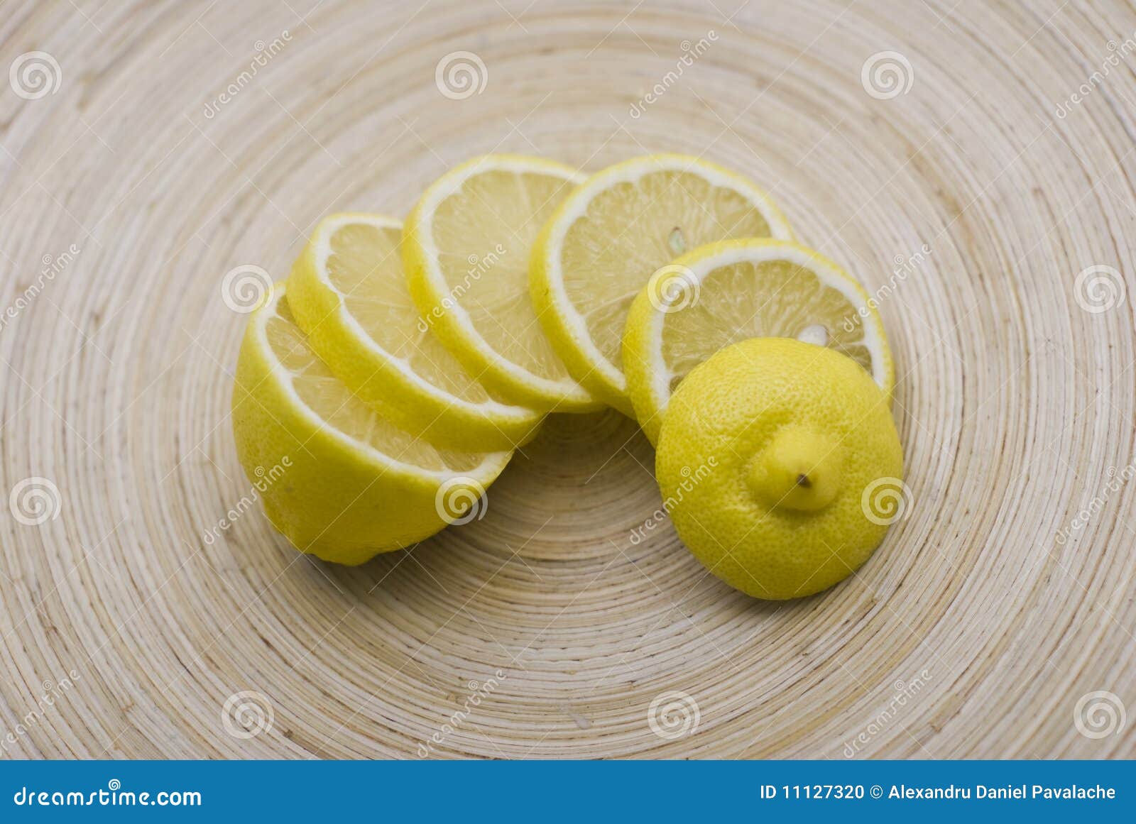 Slices of lemon on plate stock photo. Image of ingredient - 11127320