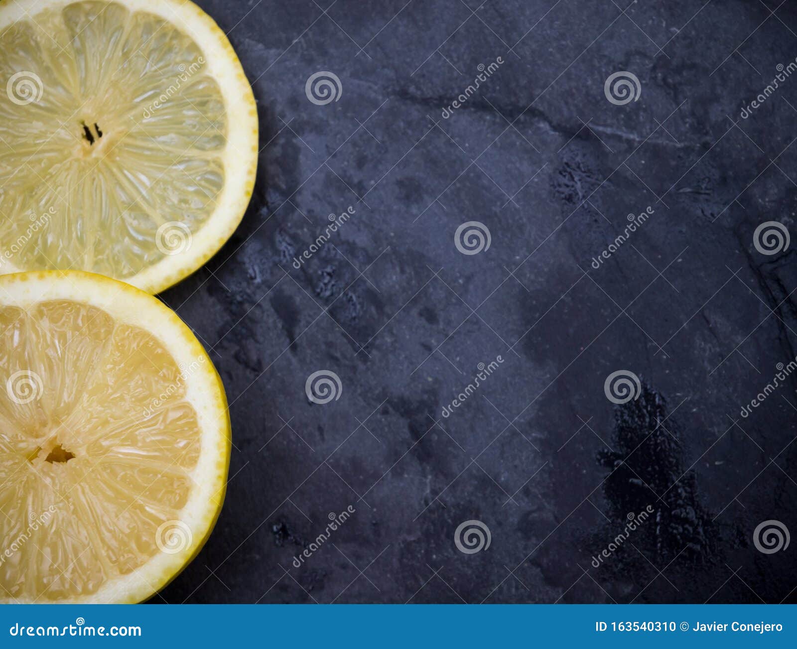 Slices of Lemon on Slate Wet Stone Stock Photo - Image of dark ...