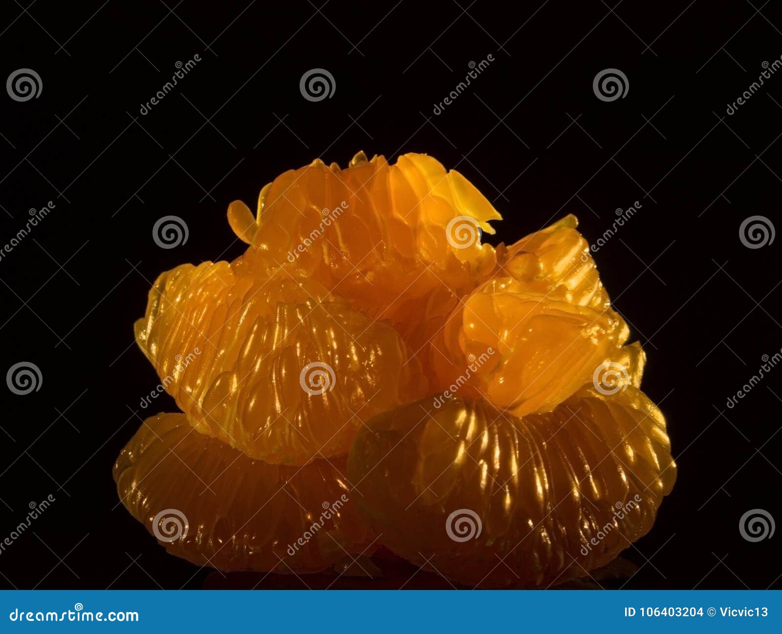 Slices of Mandarin on a Black Background Stock Photo - Image of citrus ...