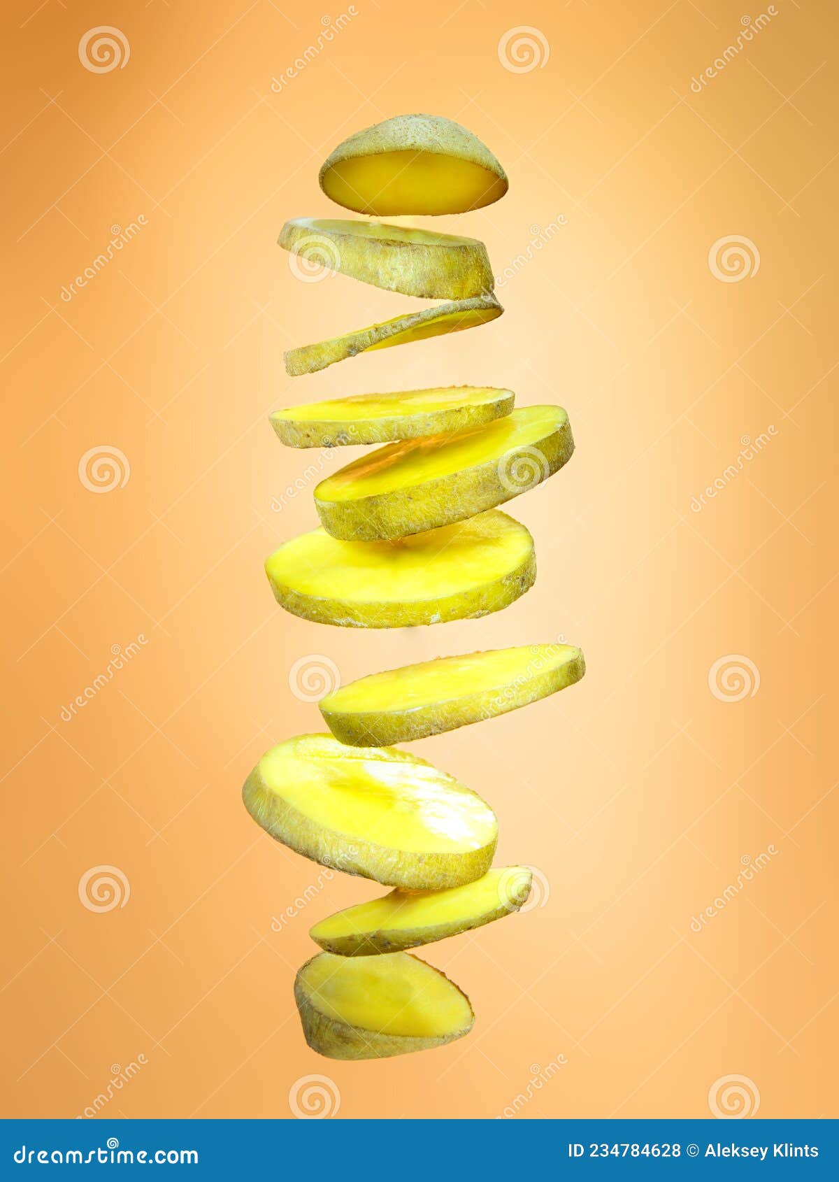 Slices of Potato Floating on Orange Background Stock Photo - Image of ...