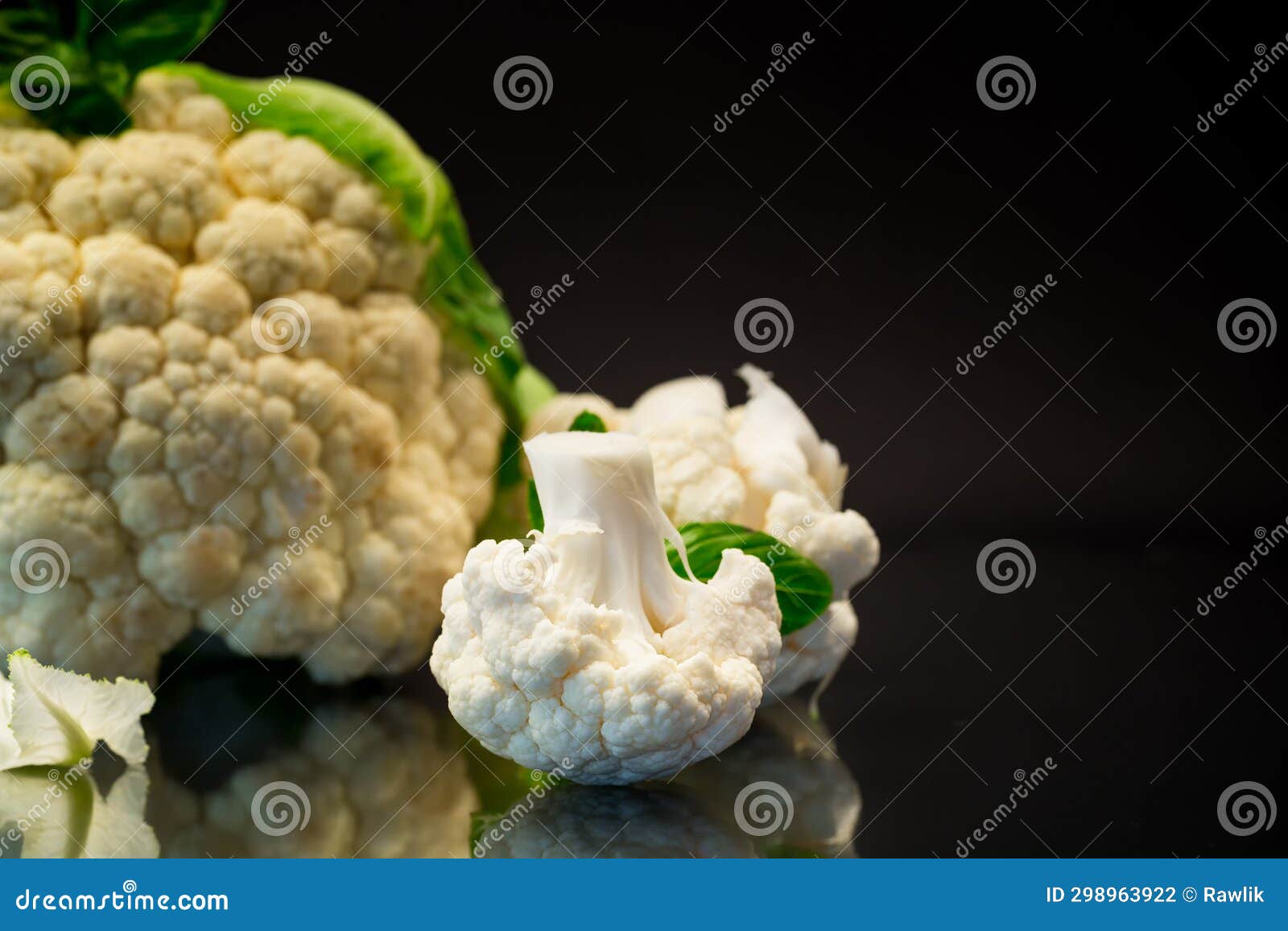Slices of Raw Small Raw Cauliflower on Black Background Stock Photo ...