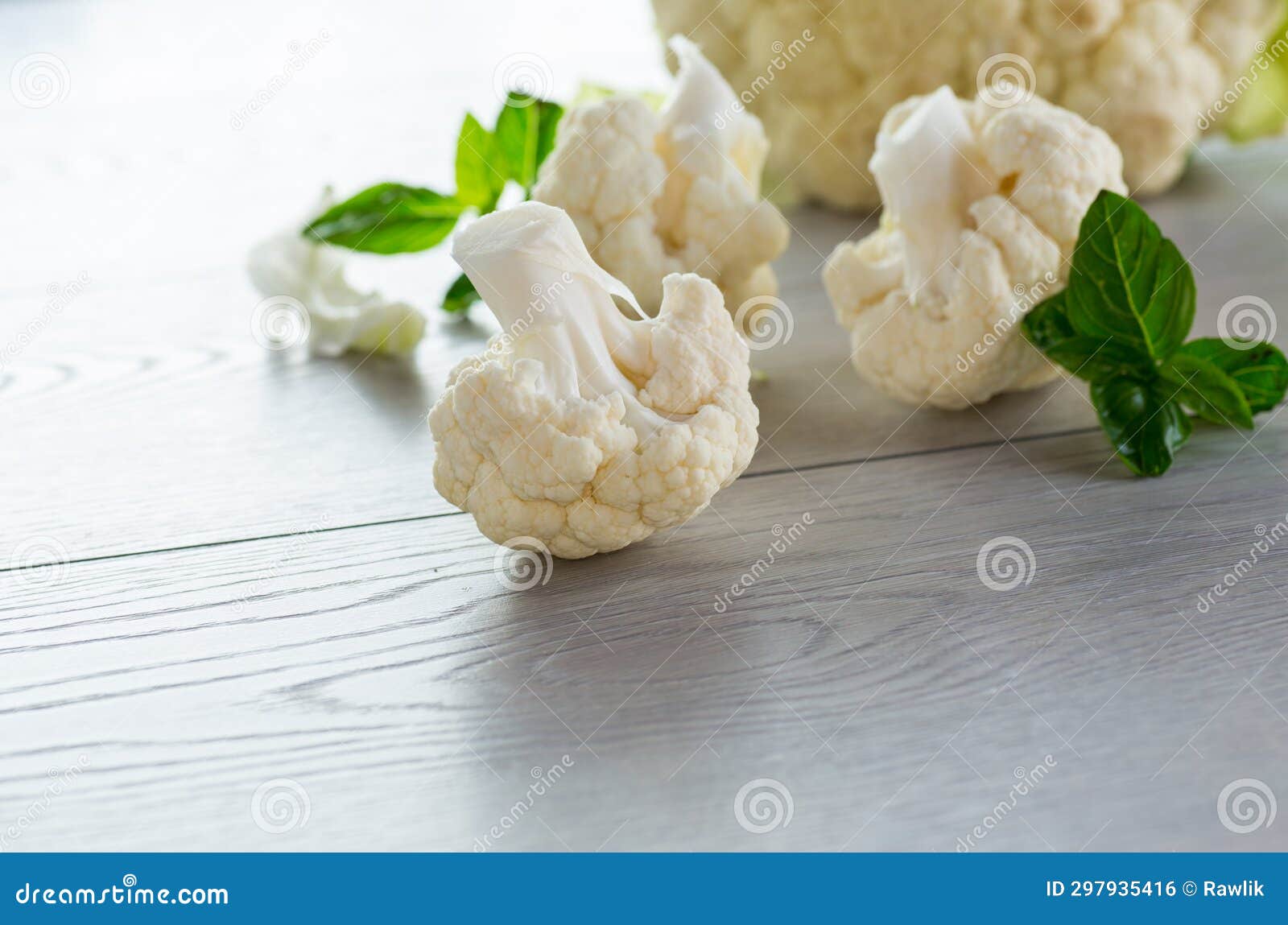 Slices of Raw Small Raw Cauliflower on Wooden Table Stock Photo - Image ...