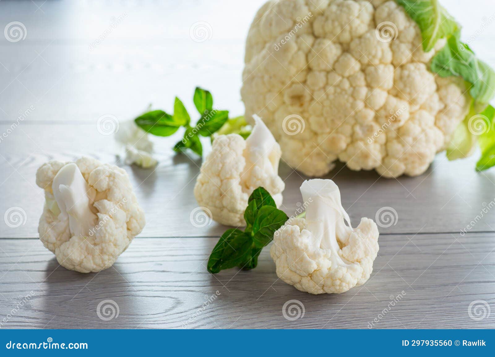 Slices of Raw Small Raw Cauliflower on Wooden Table Stock Photo - Image ...