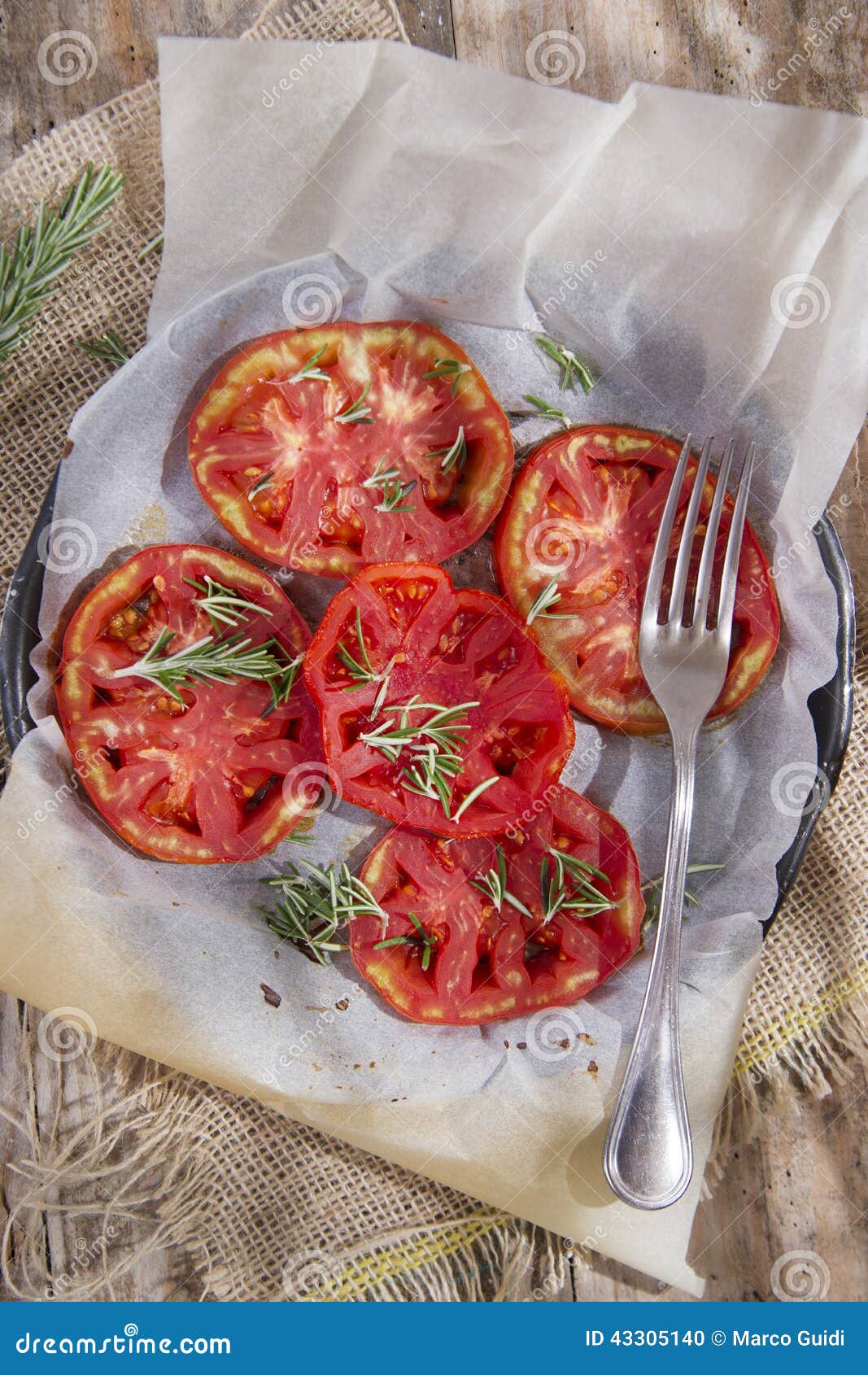 Slices of roasted tomatoes stock photo. Image of cooking - 43305140