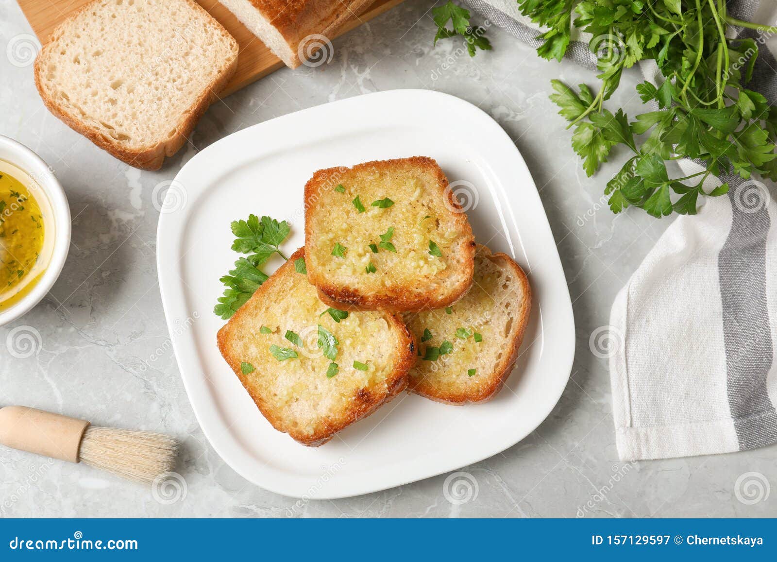 Slices of Toasted Bread with Garlic and on Light Grey Marble Table ...