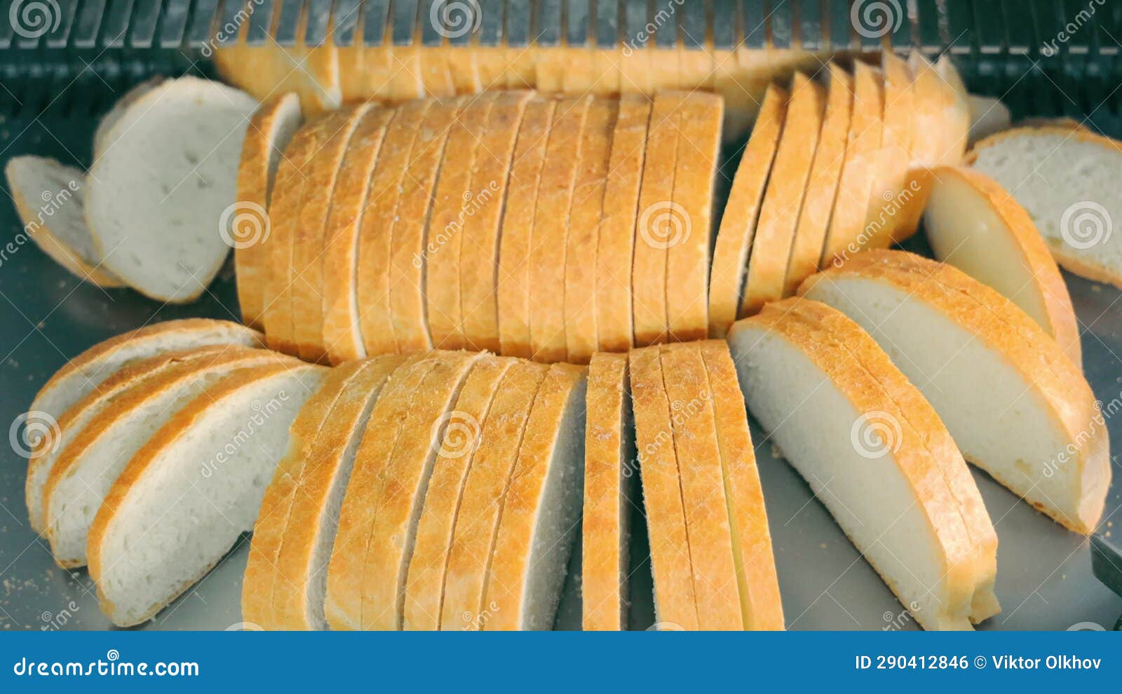 Slicing Bread in the Bakery. Automatic Line for Cutting Pieces of Bread ...