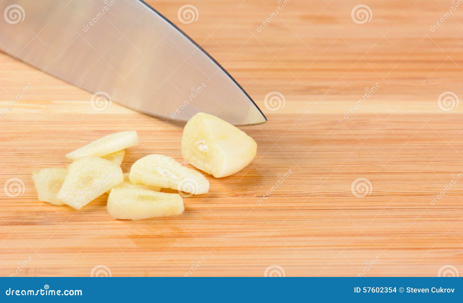 Slicing Garlic Closeup stock photo. Image of wood, agriculture - 57602354