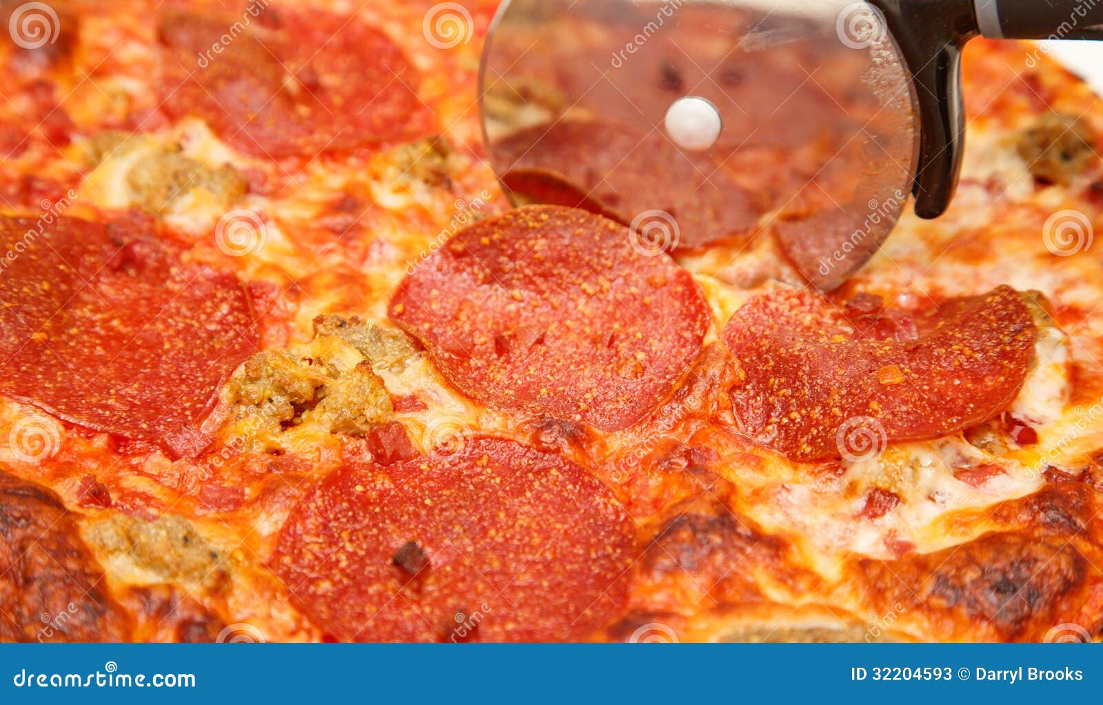 Slicing a Hot Pepperoni Pizza Stock Image - Image of cutter, cuisine ...