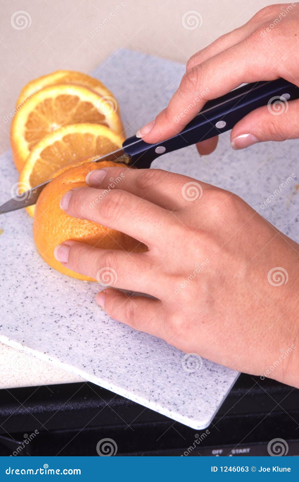 Slicing an Orange stock image. Image of tool, counter - 1246063