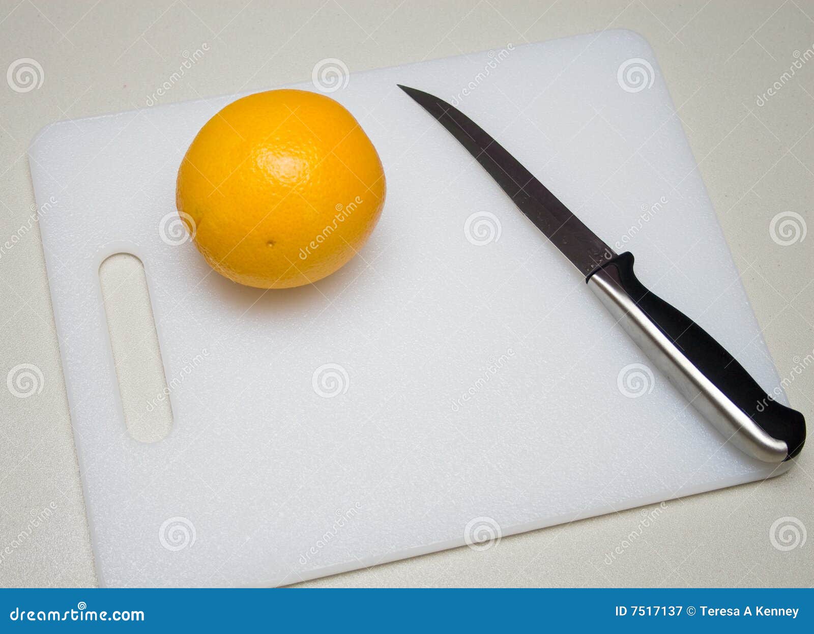Slicing an Orange stock image. Image of table, single - 7517137