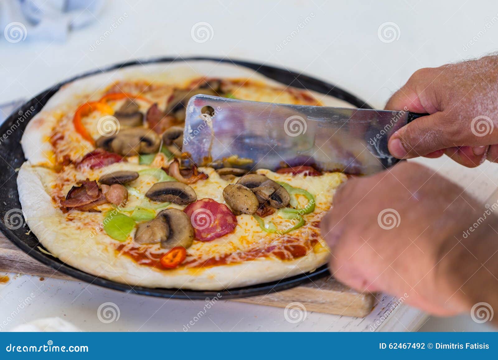 Slicing Pizza stock photo. Image of slice, white, cleaver - 62467492