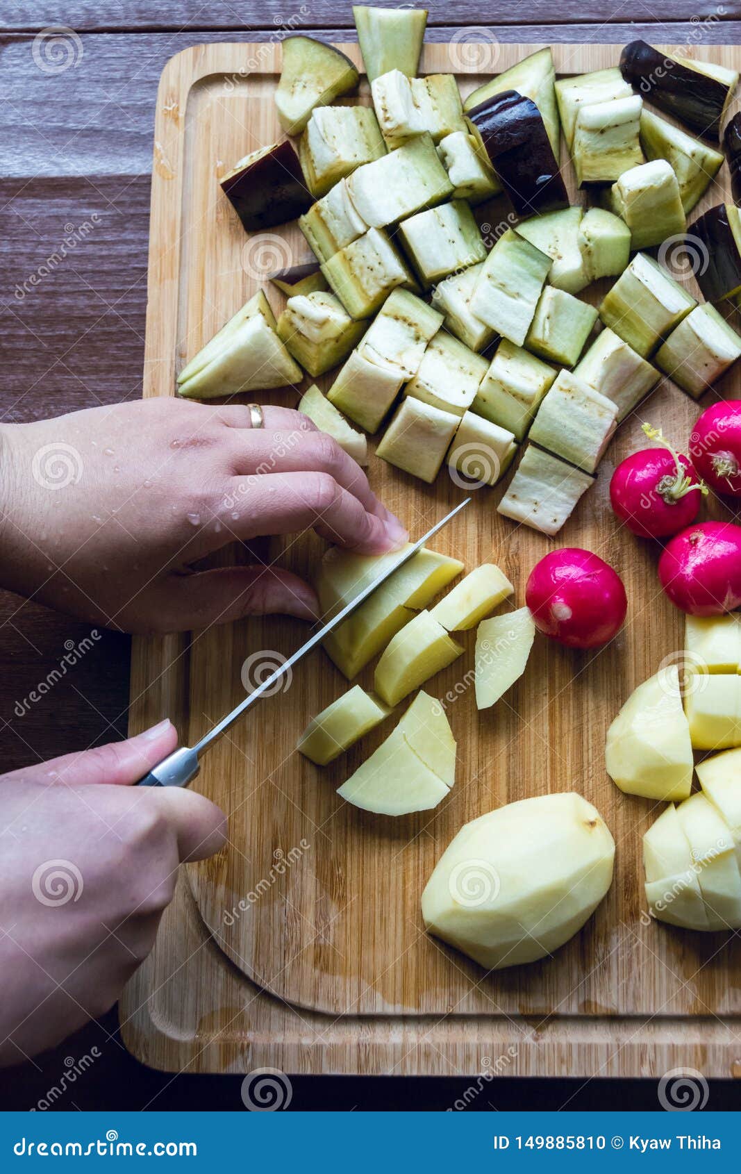 Slicing Vegetables on Chopping Board - Vertical Stock Photo - Image of ...