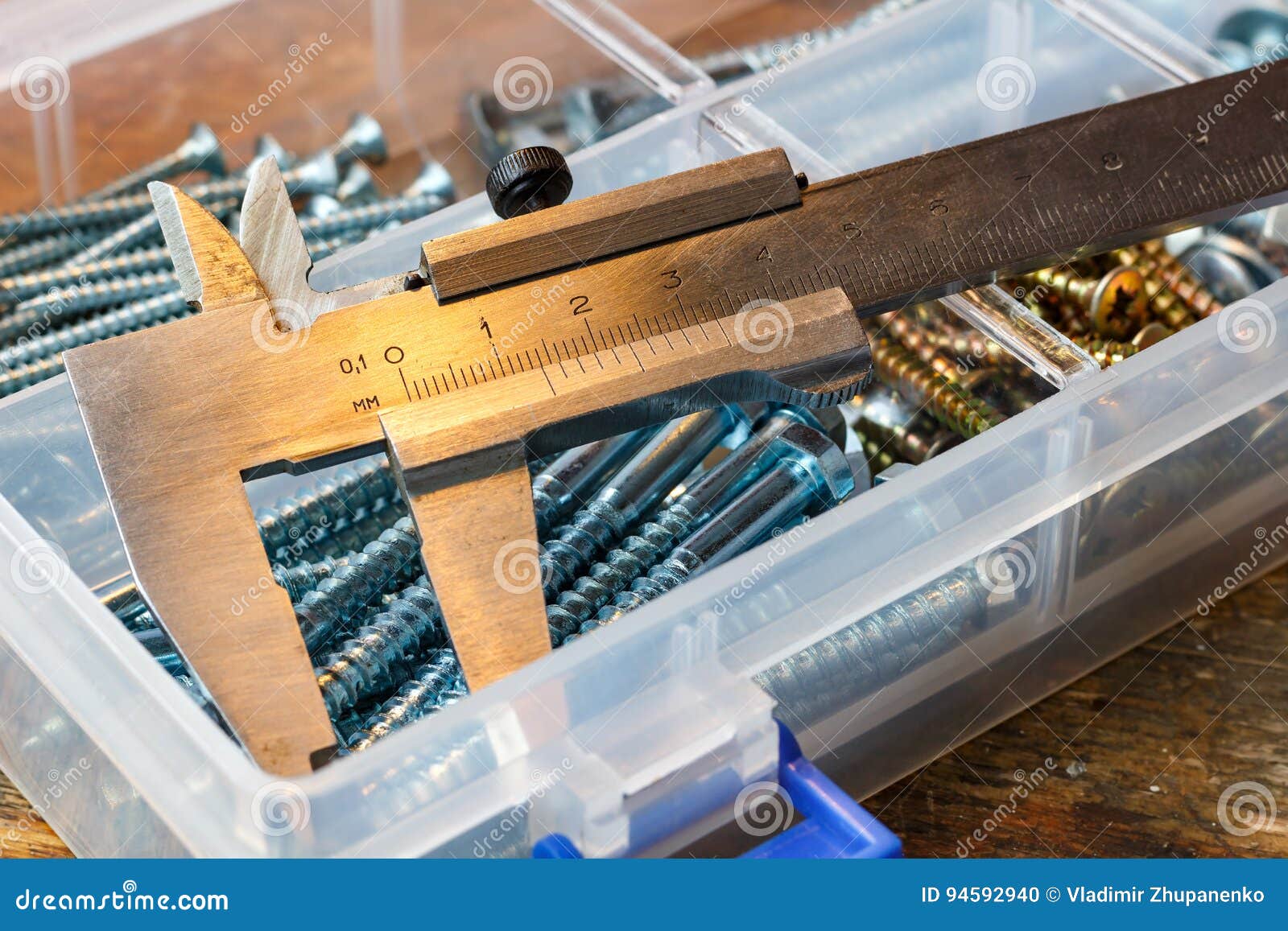 Slide Calipers and Self-tapping Screws in a Storage Box on a Workbench ...