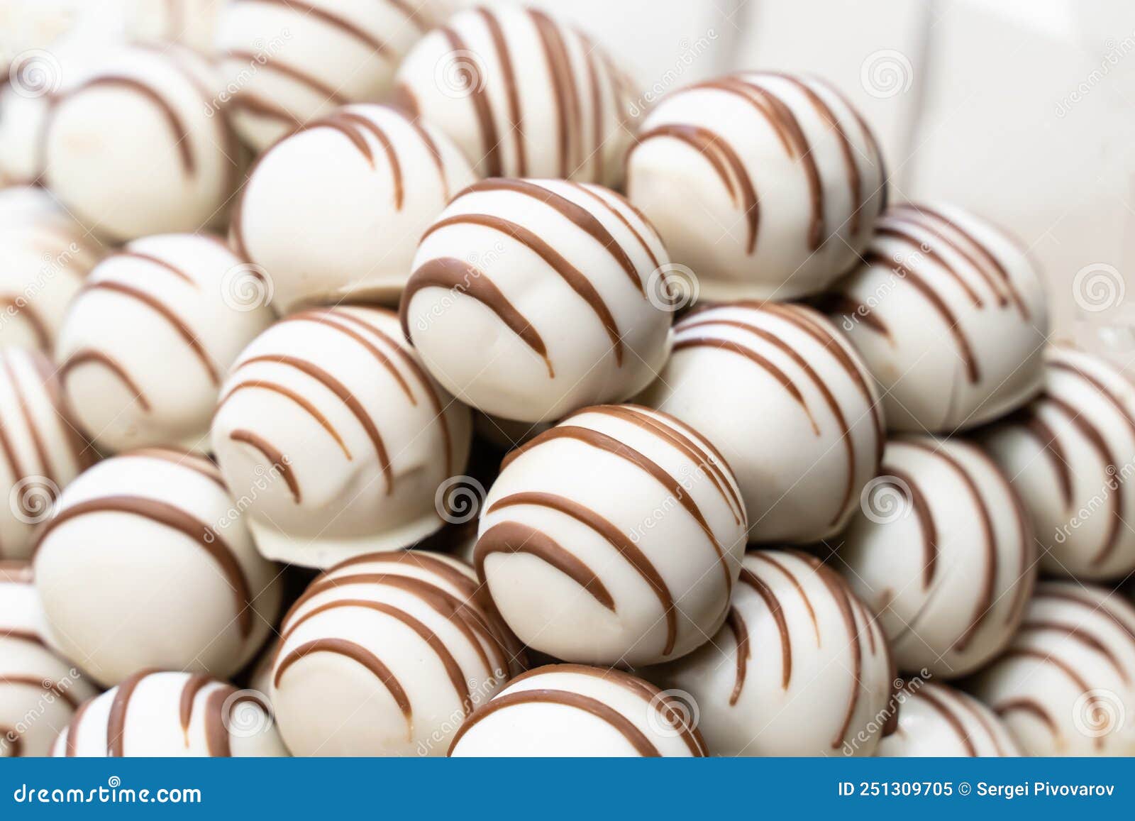 Slide of Chocolates Covered with White Chocolate and Lines from Brown ...