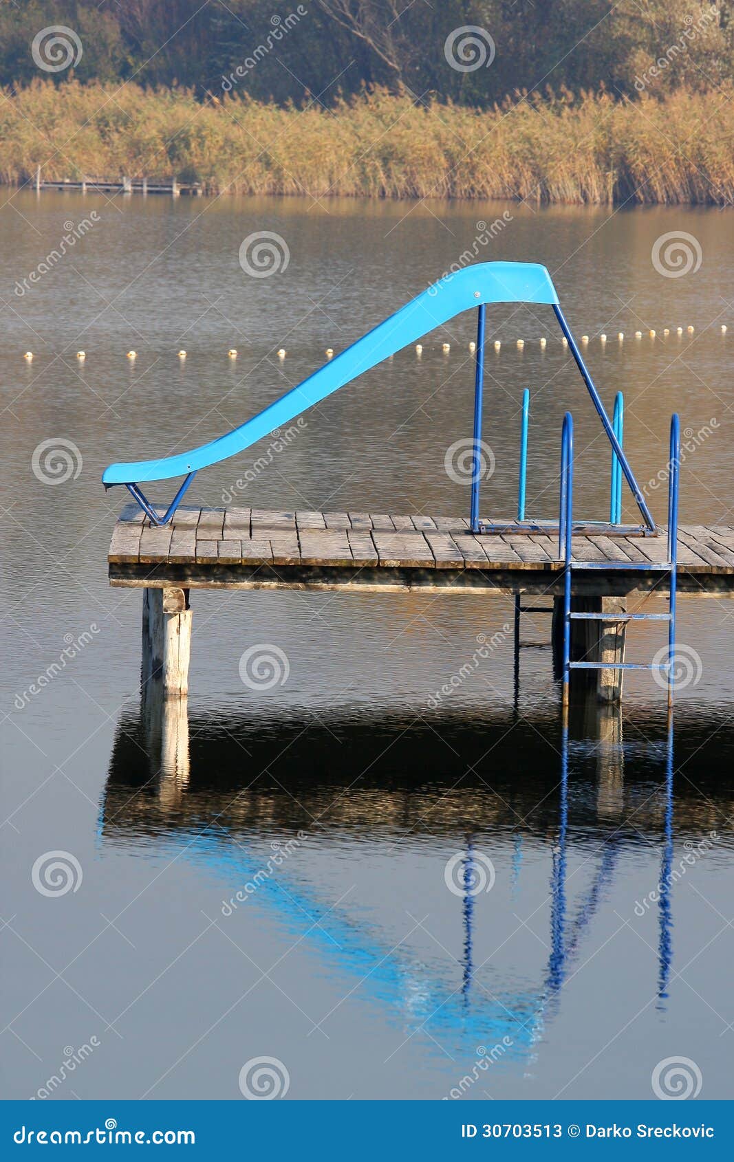 Slide on the lake dock stock image. Image of trees, outdoors - 30703513