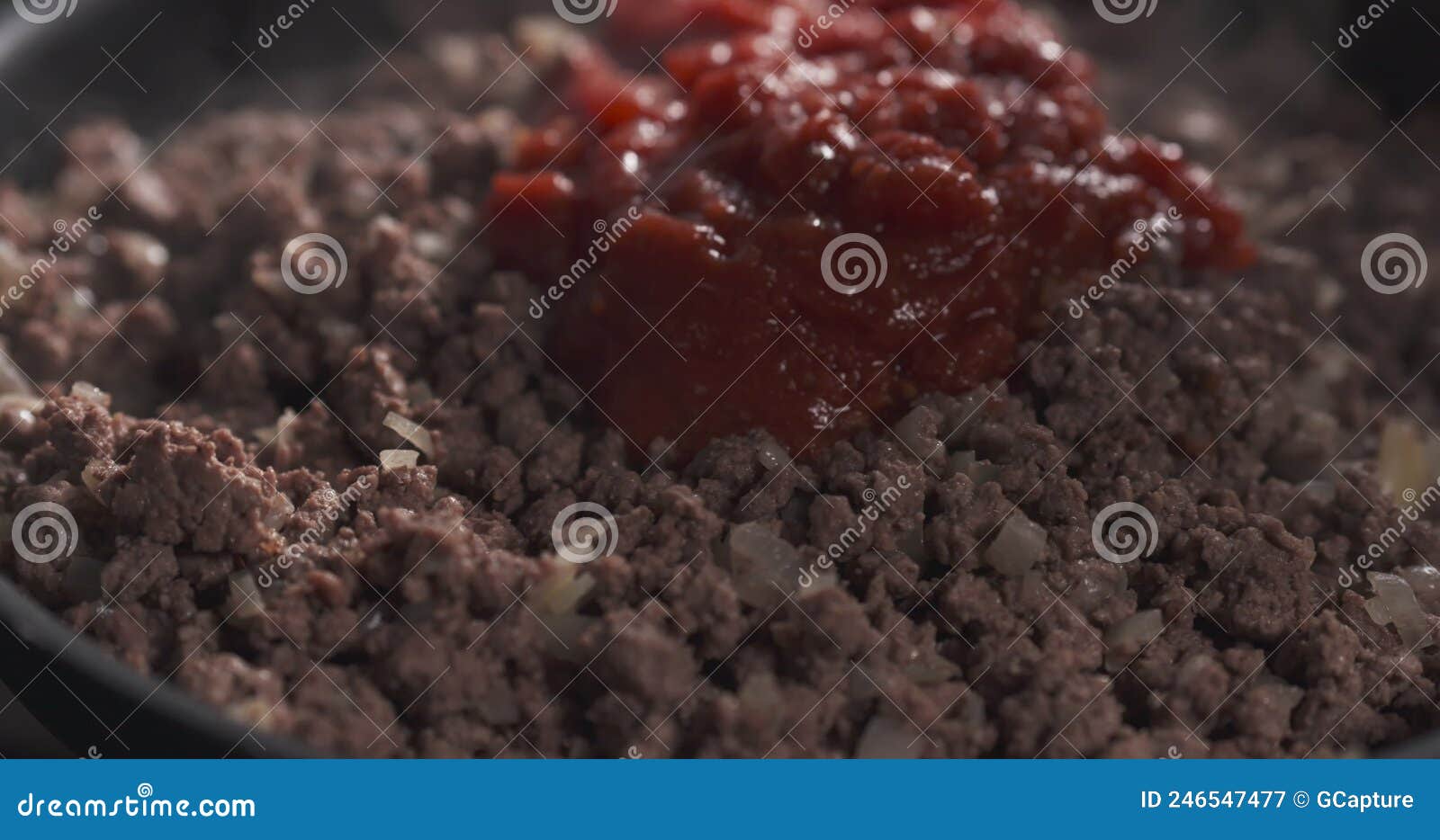 Slide Shot of Adding Tomato Paste into Roasting Minced Beef in a Pan ...