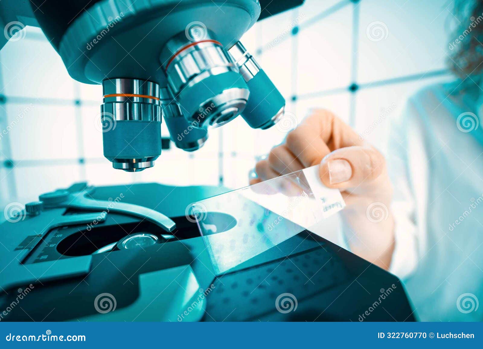 Slide Under Microscope Lenses in Laboratory Stock Photo - Image of ...