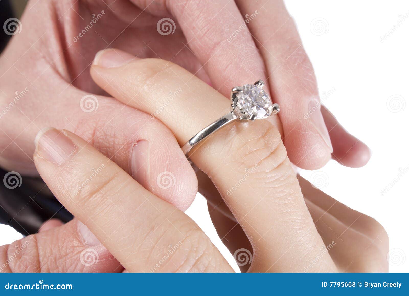 Sliding the Engagement Ring on Stock Photo - Image of married, silver ...