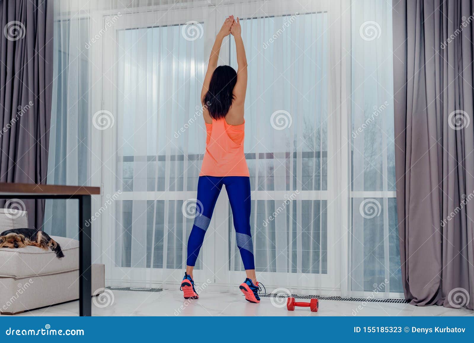 Slim brunette stretching stock image. Image of flexibility - 155185323