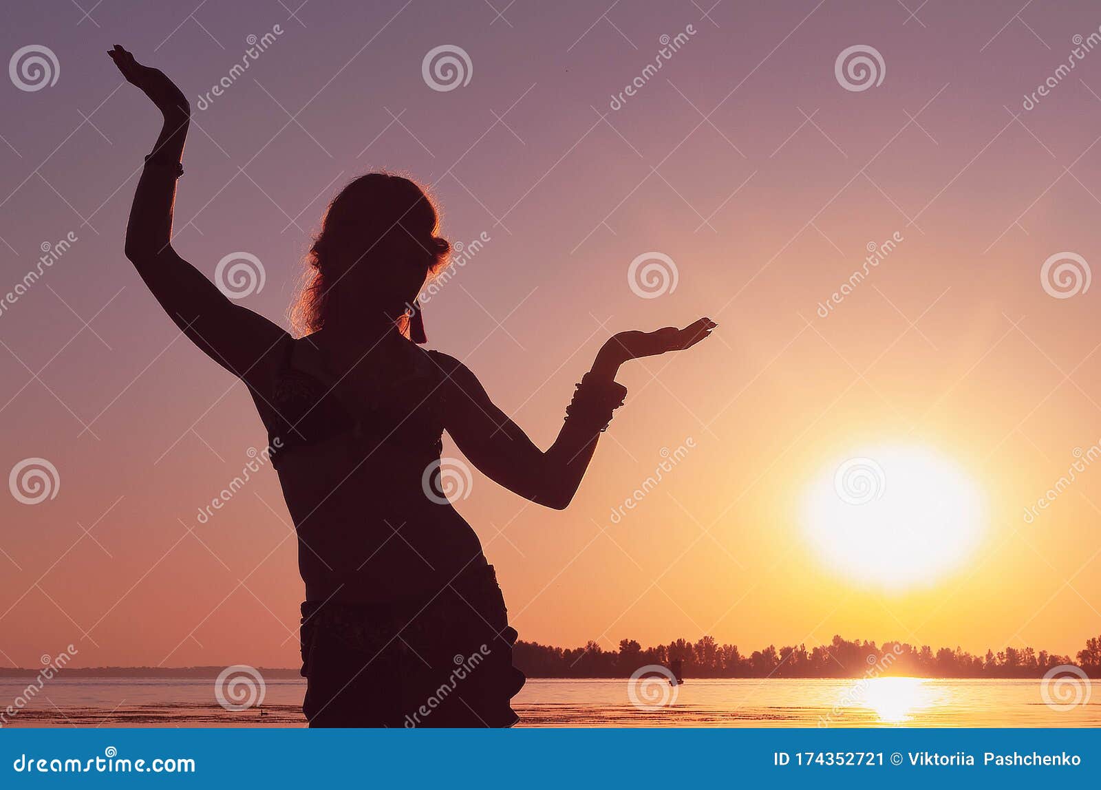 Slim Woman Illuminated With Sunshine Dancing Traditional Tribal Belly