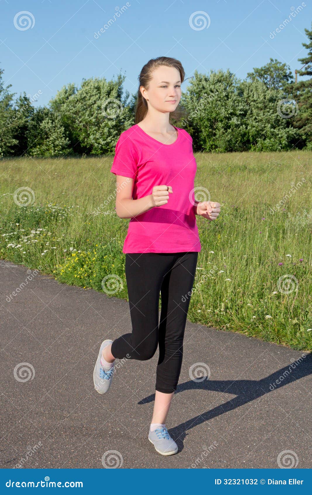 Slim woman running in park stock photo. Image of female - 32321032