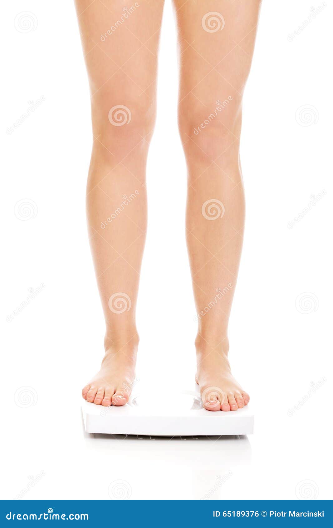 Slim woman s legs on scale stock photo. Image of control - 65189376