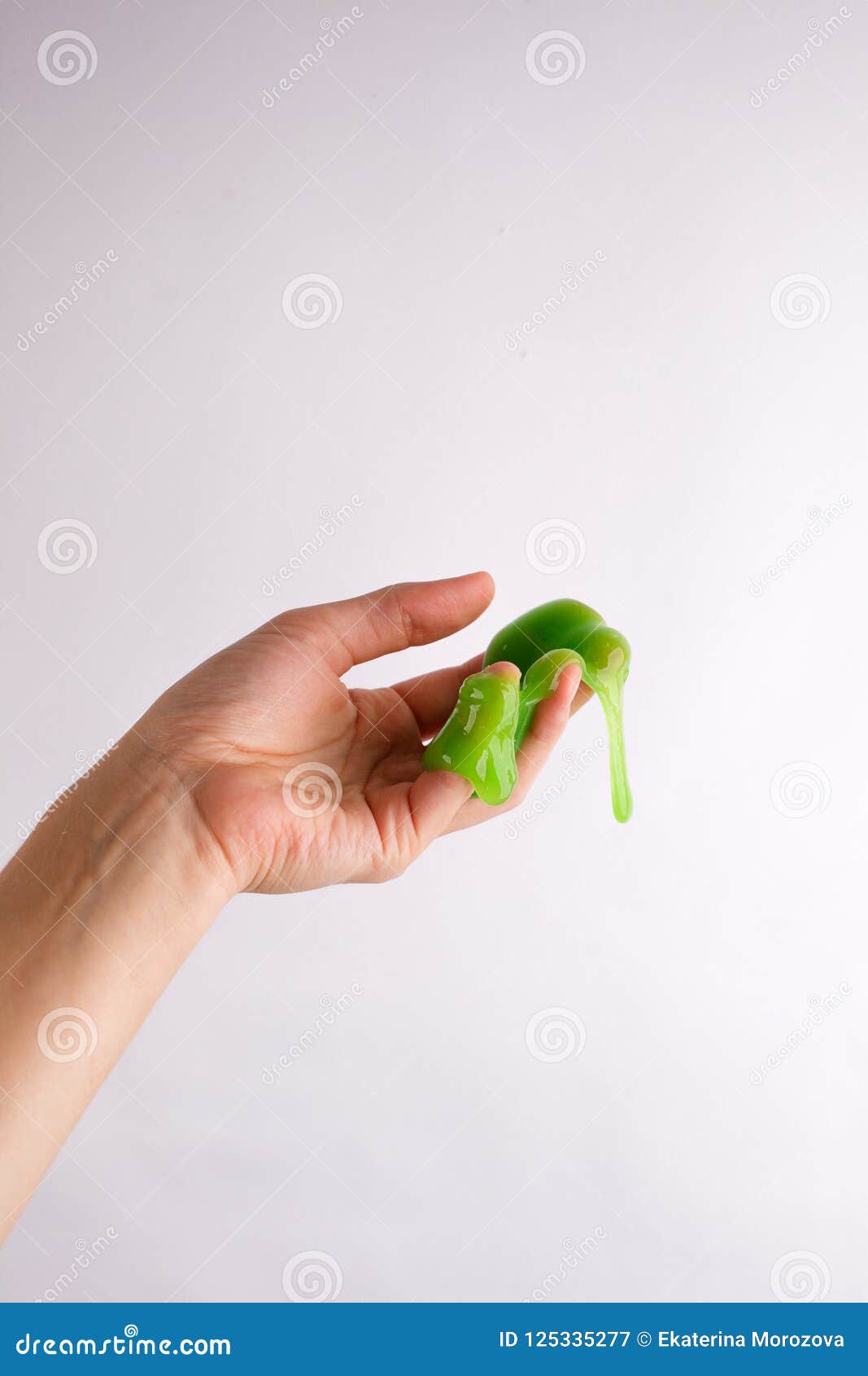 Slime Paste Green Elastic and Viscous, Woman Hand Holding Slime Stock ...