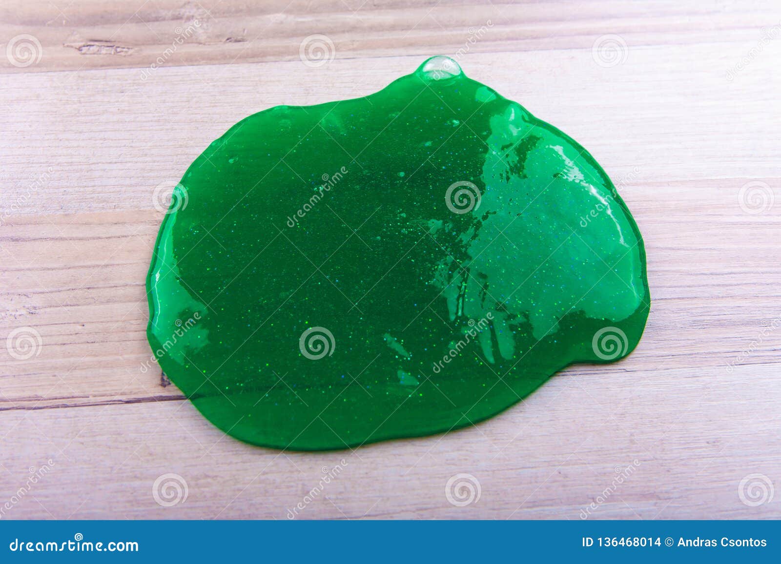Slime on a wooden surface stock photo. Image of wooden - 136468014