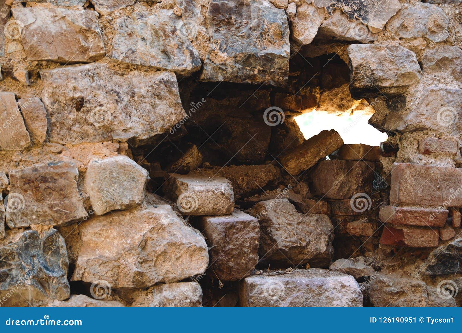 Slit in the stone wall stock image. Image of collapsed - 126190951