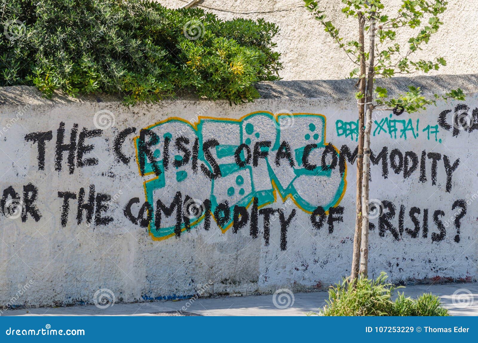 Slogan on a wall in Greece stock image. Image of point - 107253229