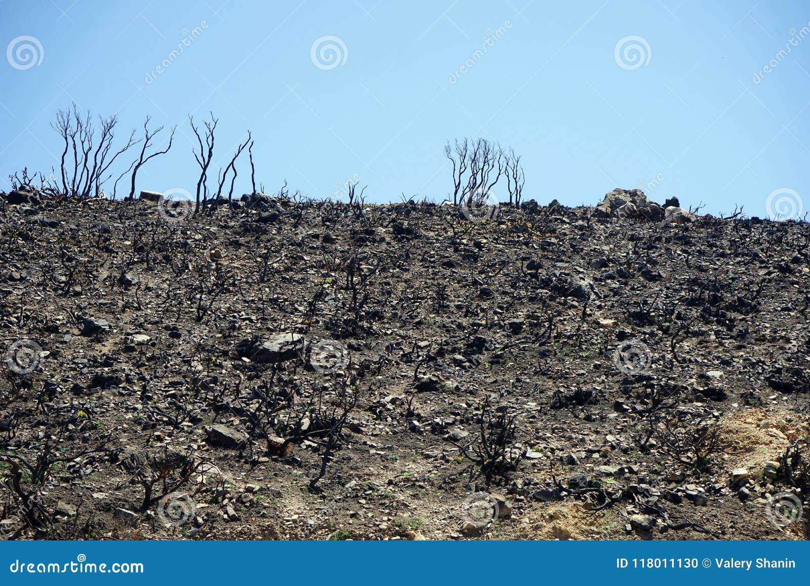 Burned slope of rock stock photo. Image of arid, rock - 118011130