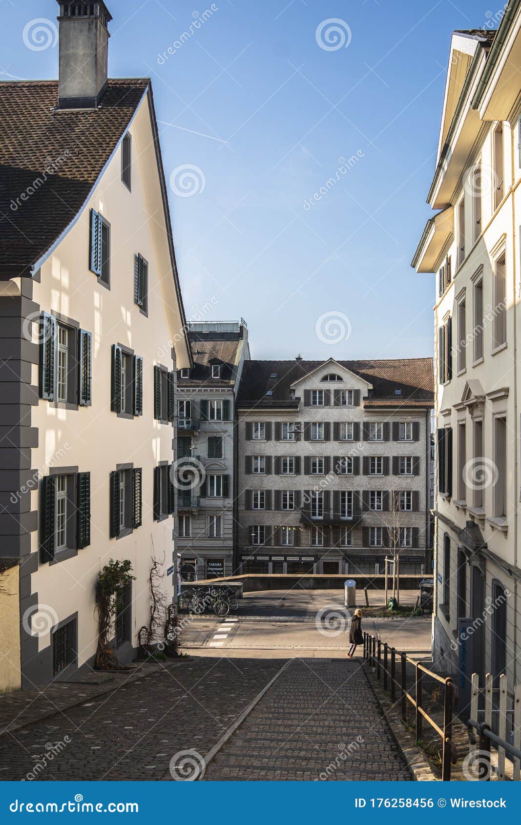 Sloped Street between Buildings Under a Clear Blue Sky Editorial Photo ...