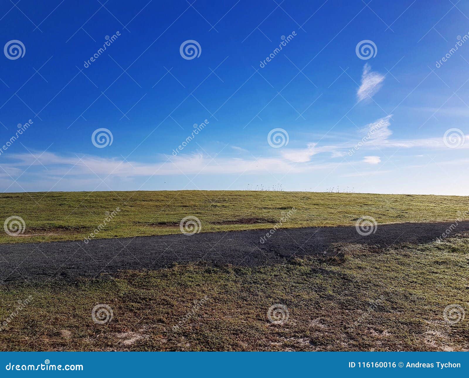 Gently Sloping Hill Against a Blue Sky Stock Photo - Image of gently ...