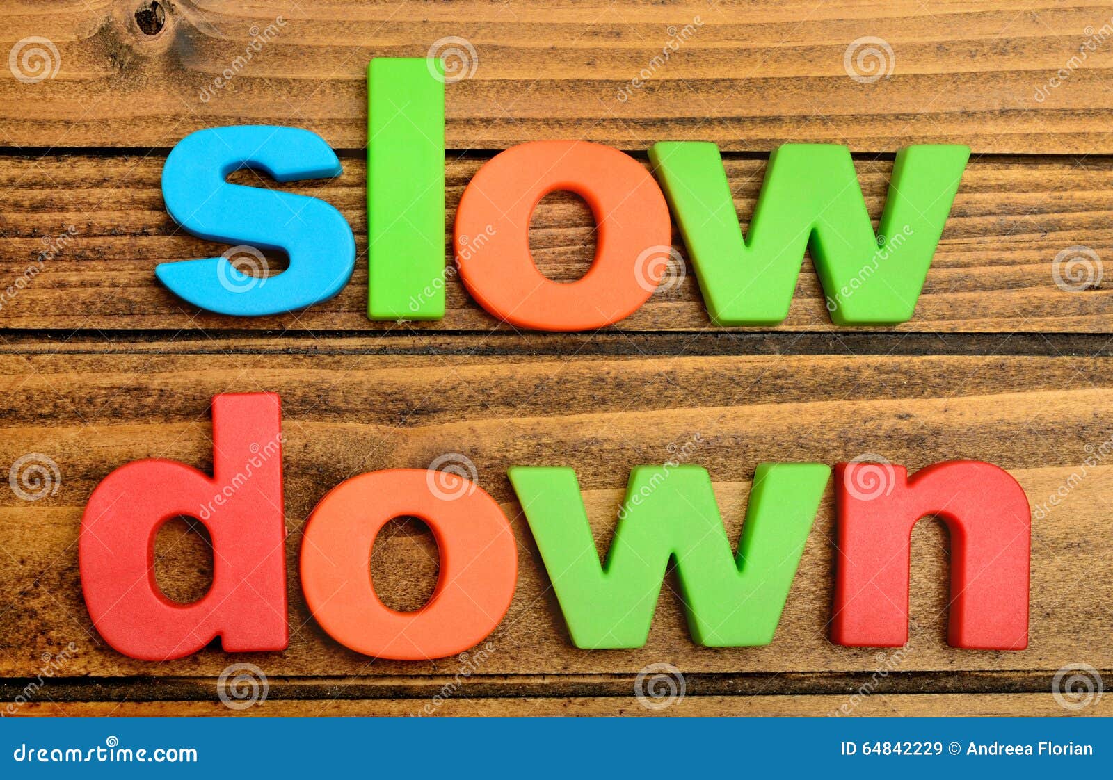 Slow Down word on table stock image. Image of slow, letter - 64842229