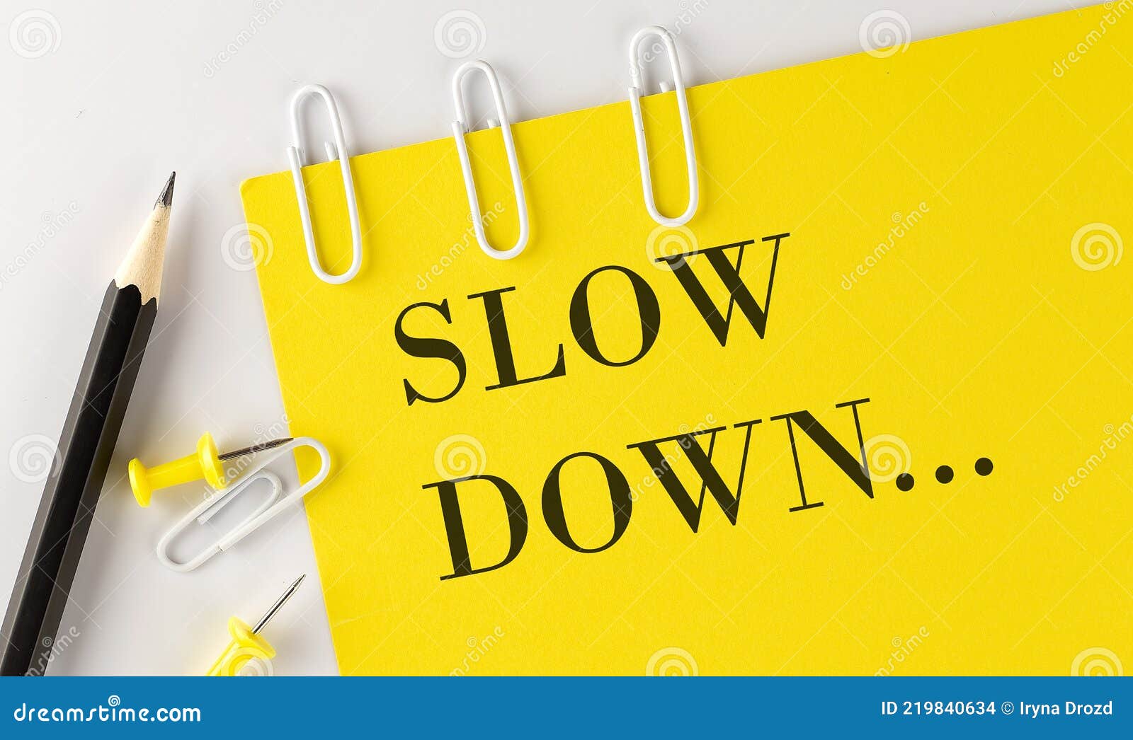 SLOW DOWN Word on the Yellow Paper with Office Tools on White ...