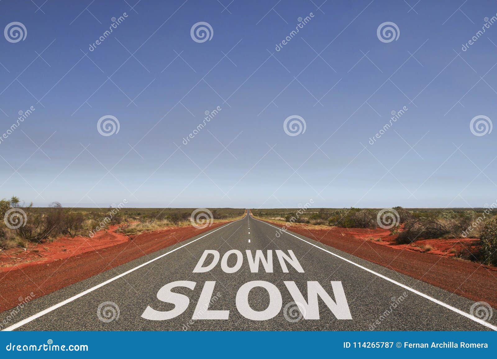 Slow Down Written on the Road Stock Image - Image of life, desert ...